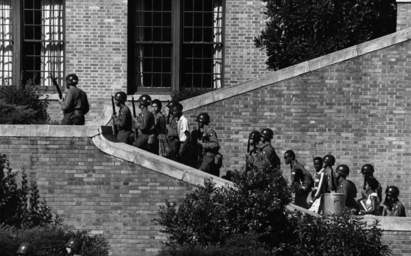 The Little Rock Nine desegregate Little Rock Central High School in ...